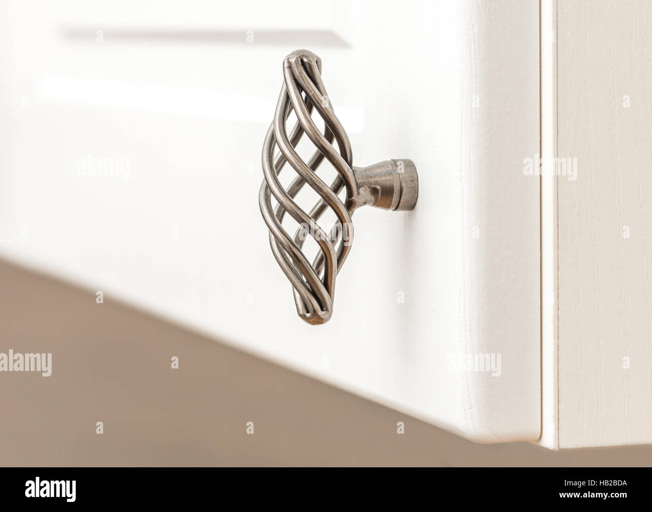 kitchen cupboard handle on door Stock Photo - Alamy