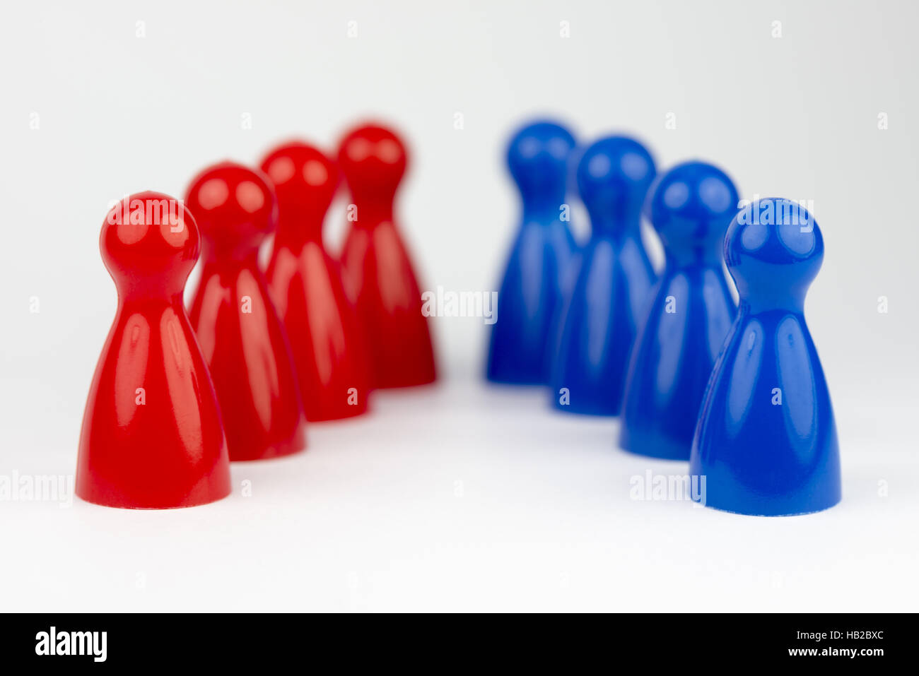 Conceptual game pawns Stock Photo - Alamy