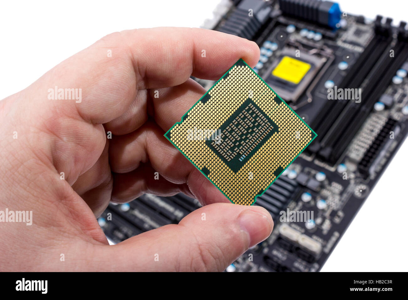 Installing modern computer processor (CPU) in moth Stock Photo - Alamy