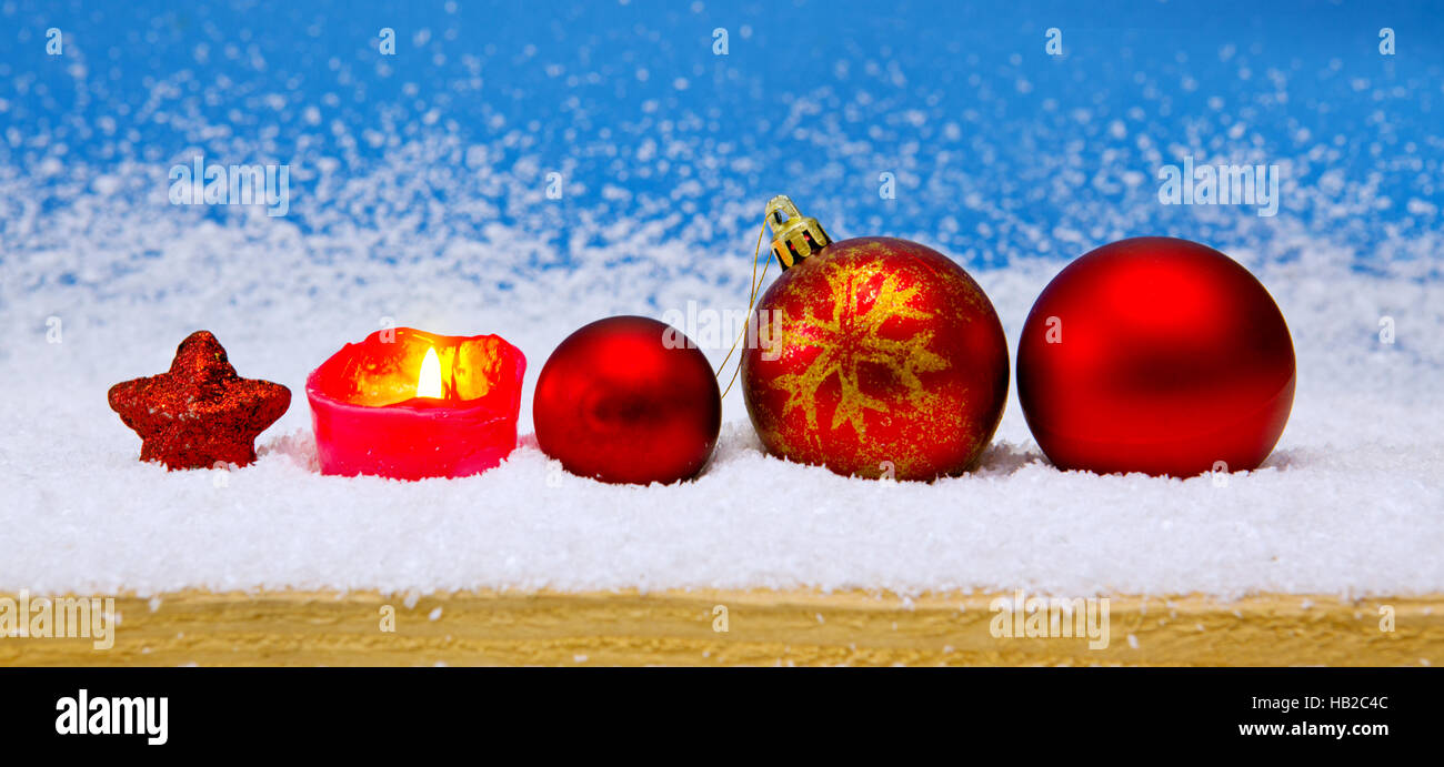 Red Christmas balls and Advent candle Stock Photo - Alamy