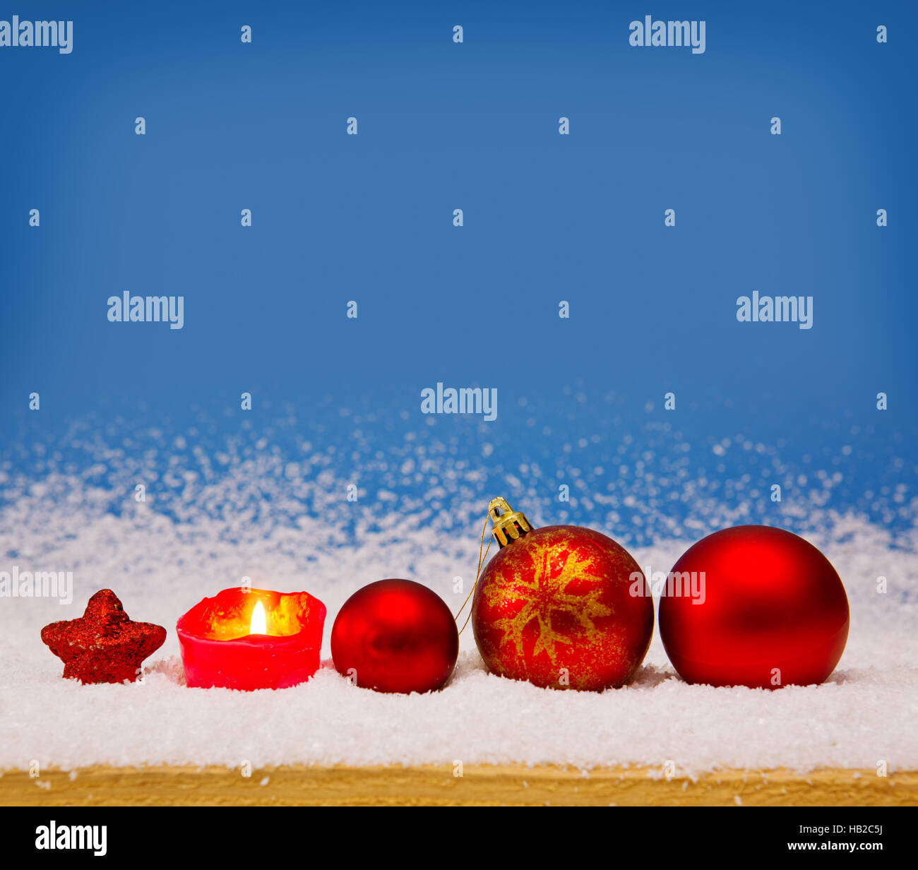 Red Christmas balls and Advent candle Stock Photo - Alamy