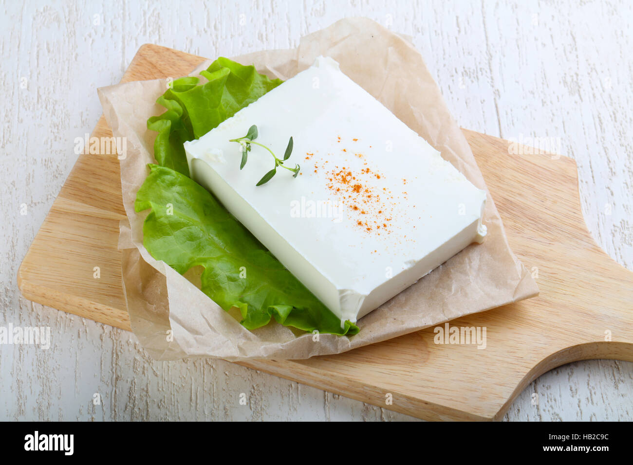 Greek traditional Feta cheese with thyme leaves Stock Photo - Alamy