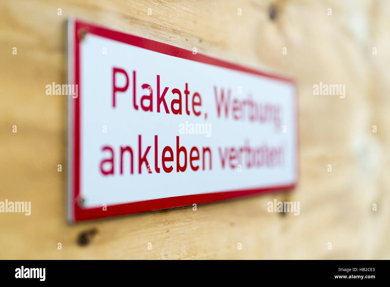 Sign with advertising ban on a house wall Stock Photo - Alamy