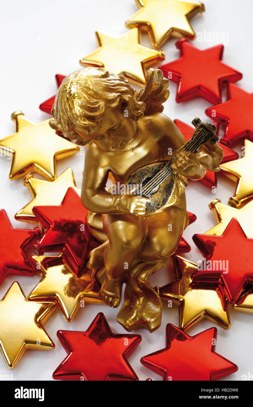 Red and golden stars and an angel Stock Photo - Alamy
