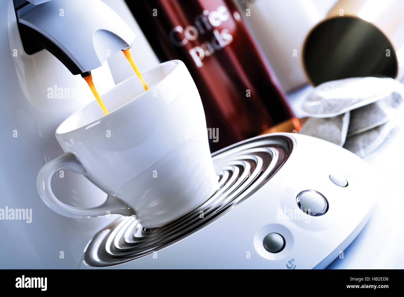 Coffee pad machine and cups Stock Photo - Alamy