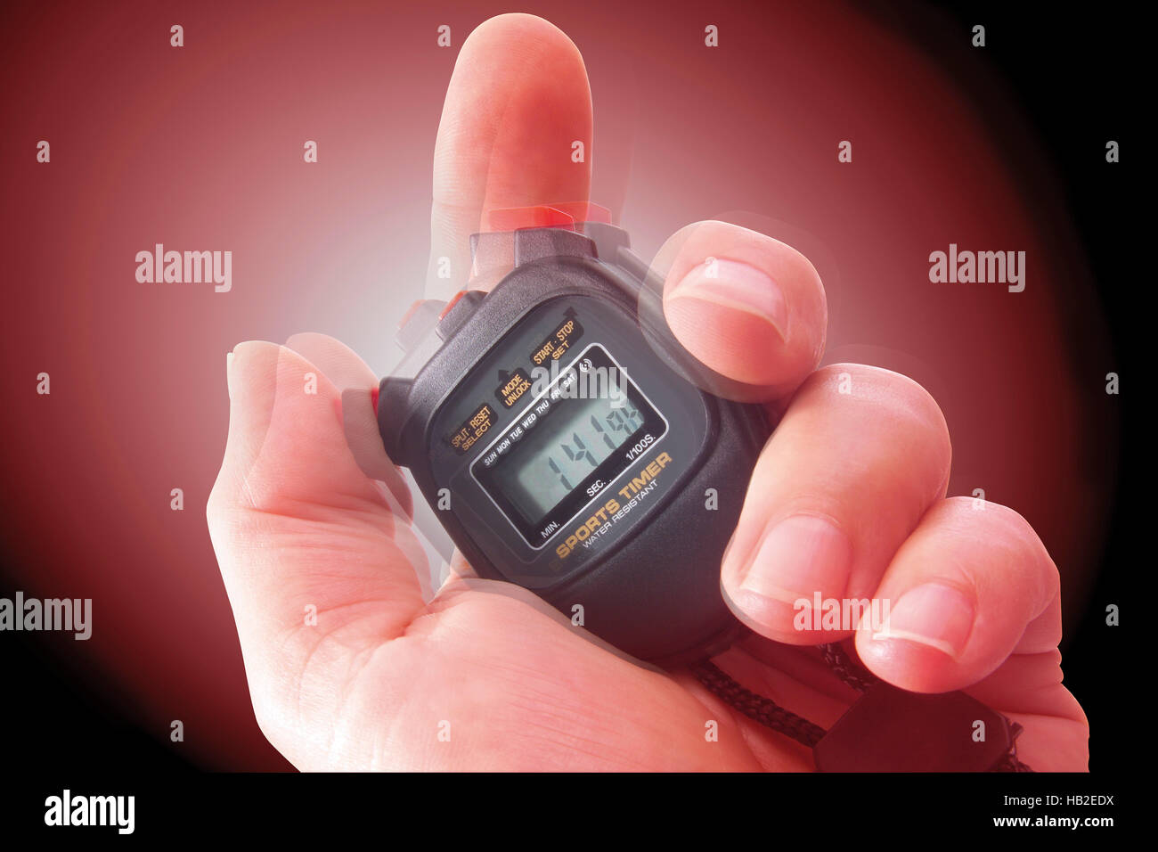 Hand holding a stop watch Stock Photo - Alamy