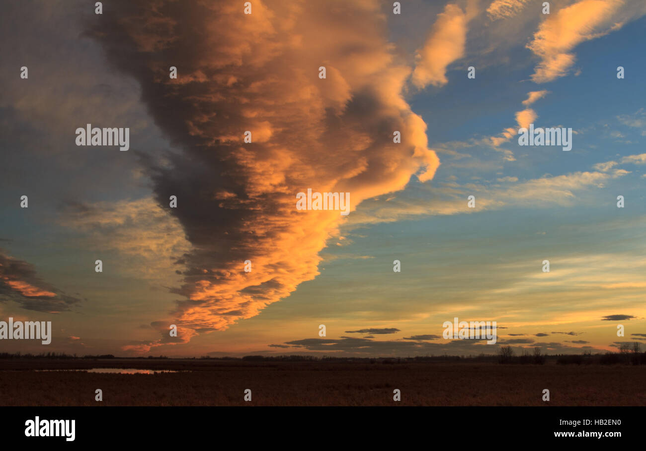 Massive funnel like cloud at sunset Stock Photo - Alamy