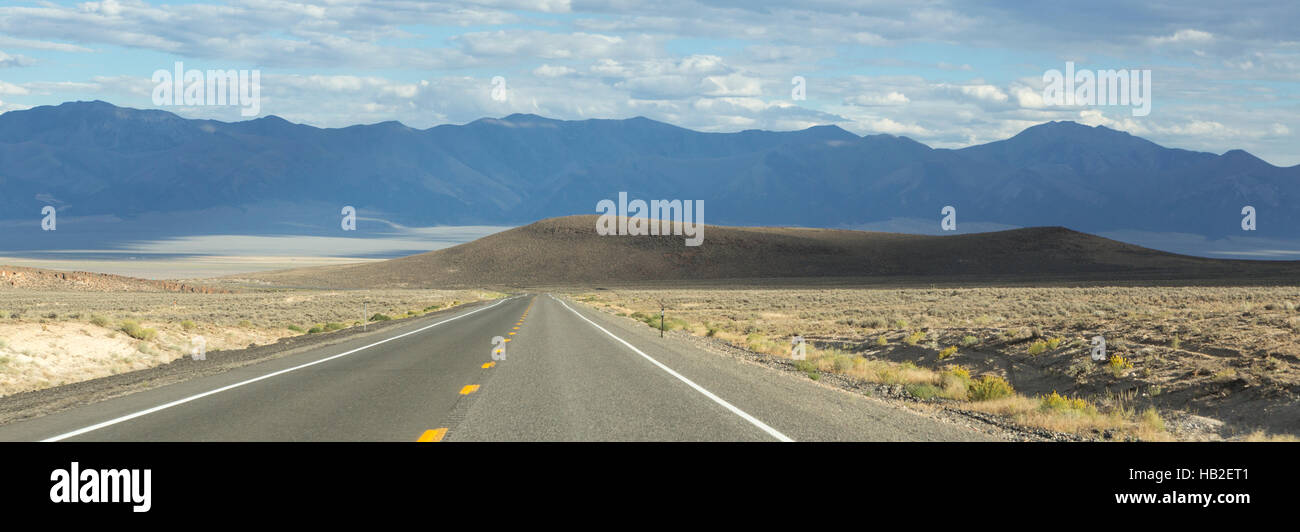 Panorama of Route 50 - the loneliest road in America with background of ...