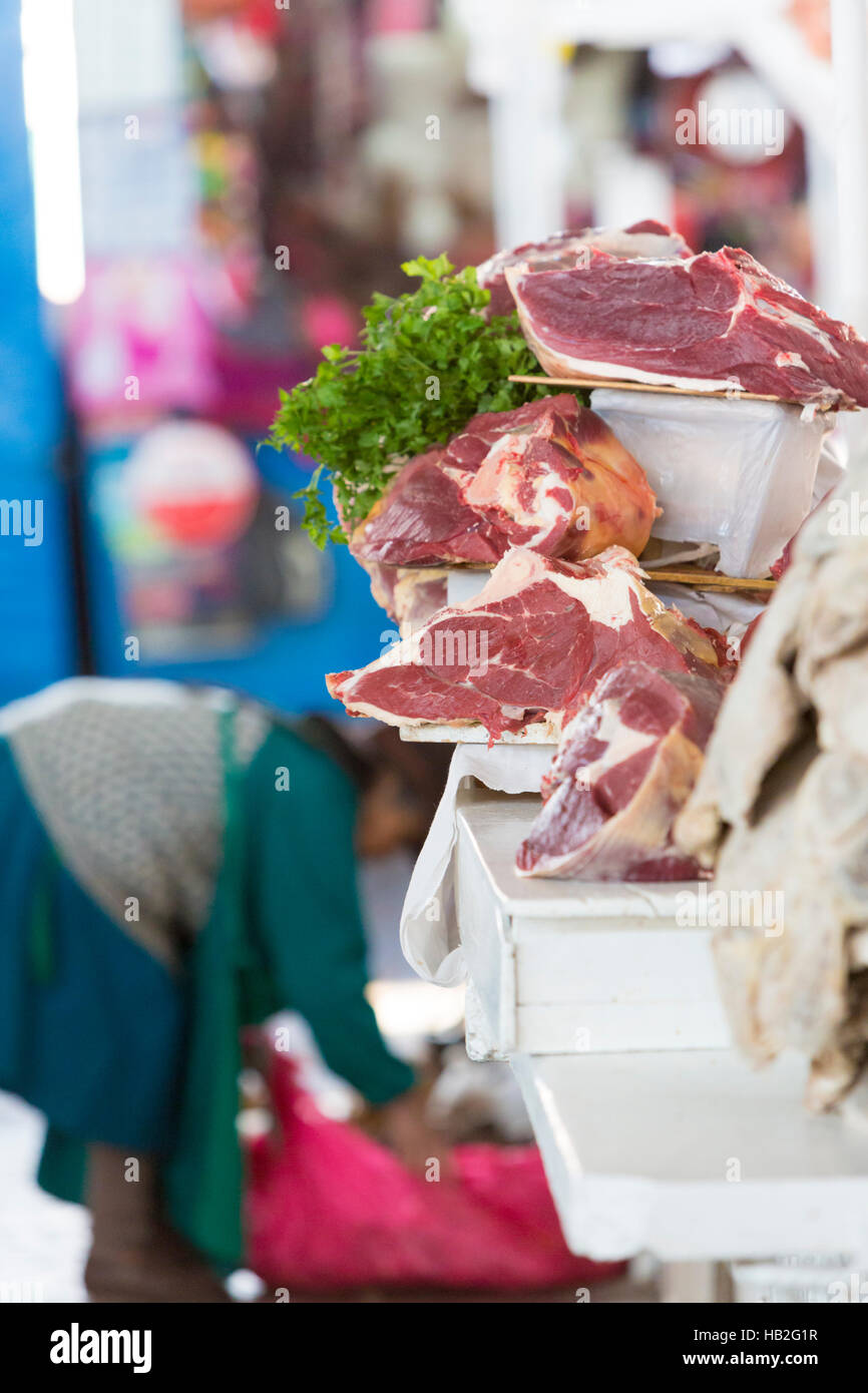 CUSCO, PERU, JANUARY 15: Fresh red meat standing on butcher stall with ...