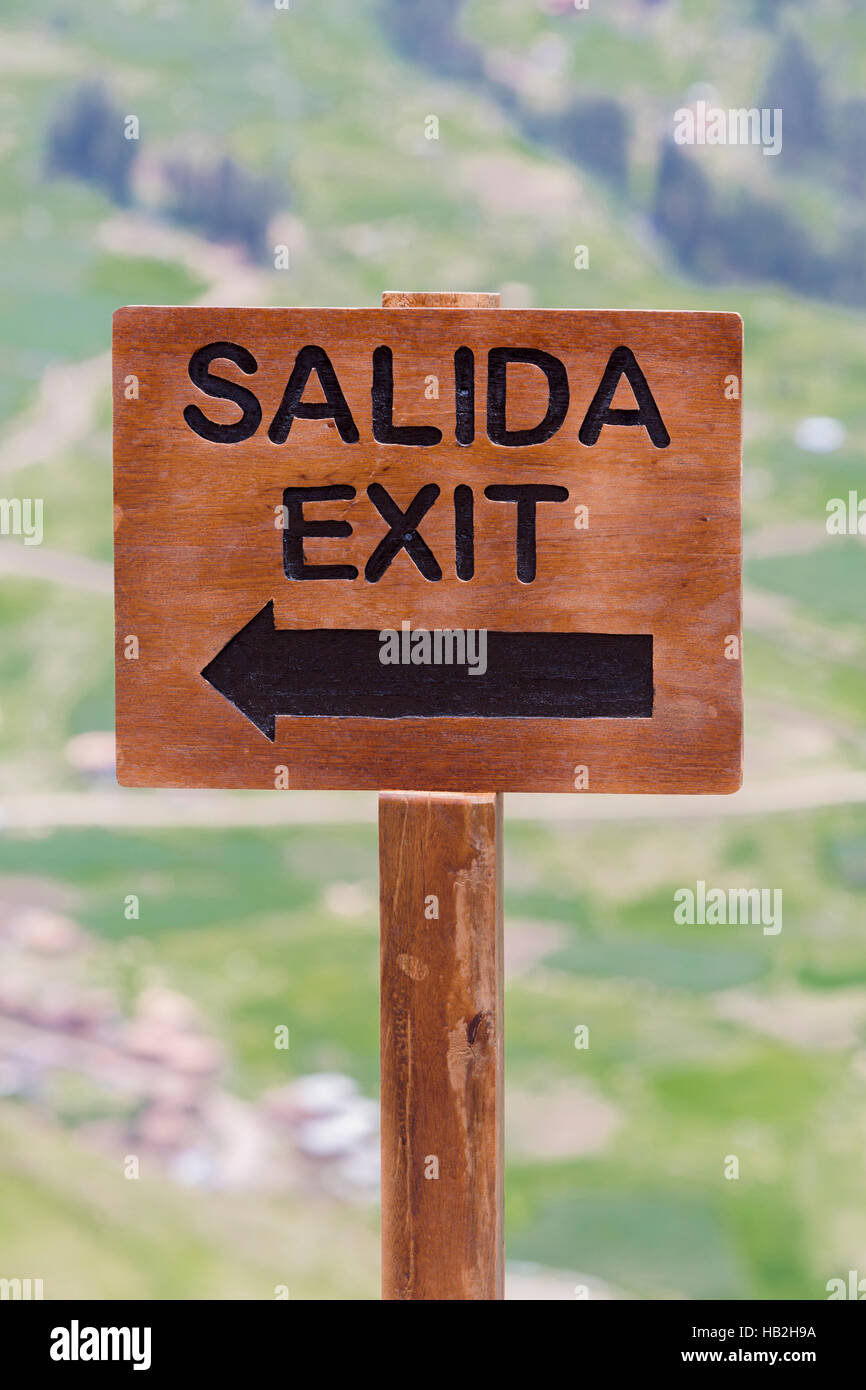 Closeup on wooden sign with Salida (Exit) written in Spanish at the ...