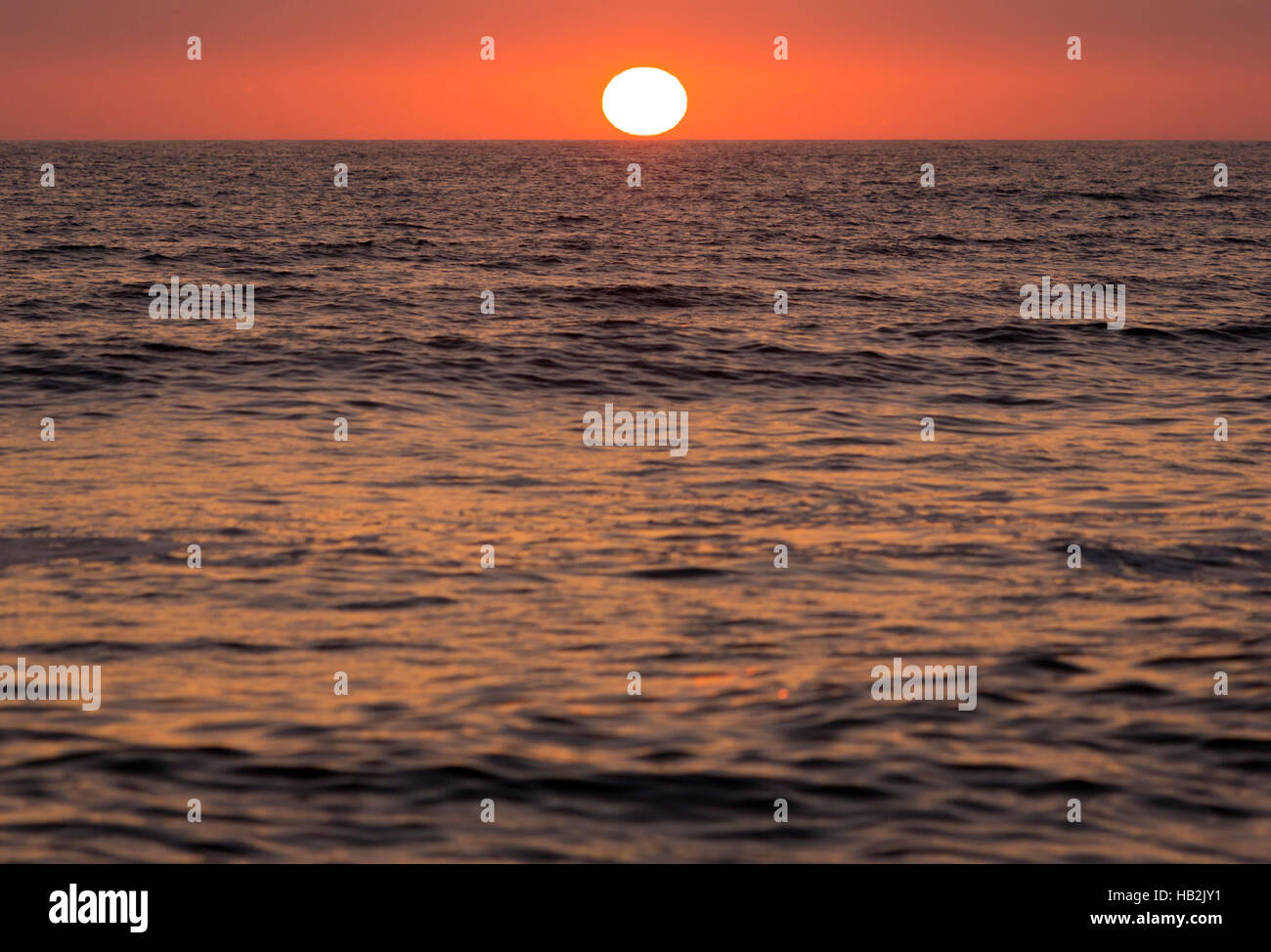 Orange Pacific sunset in Lima, Peru Stock Photo - Alamy