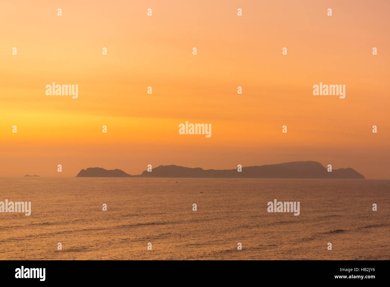 Orange Pacific sunset in Lima, Peru Stock Photo - Alamy