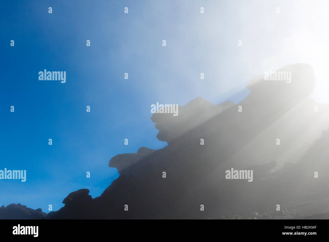 Morning sun light with silhouette of wild landscape at the top of Mt ...