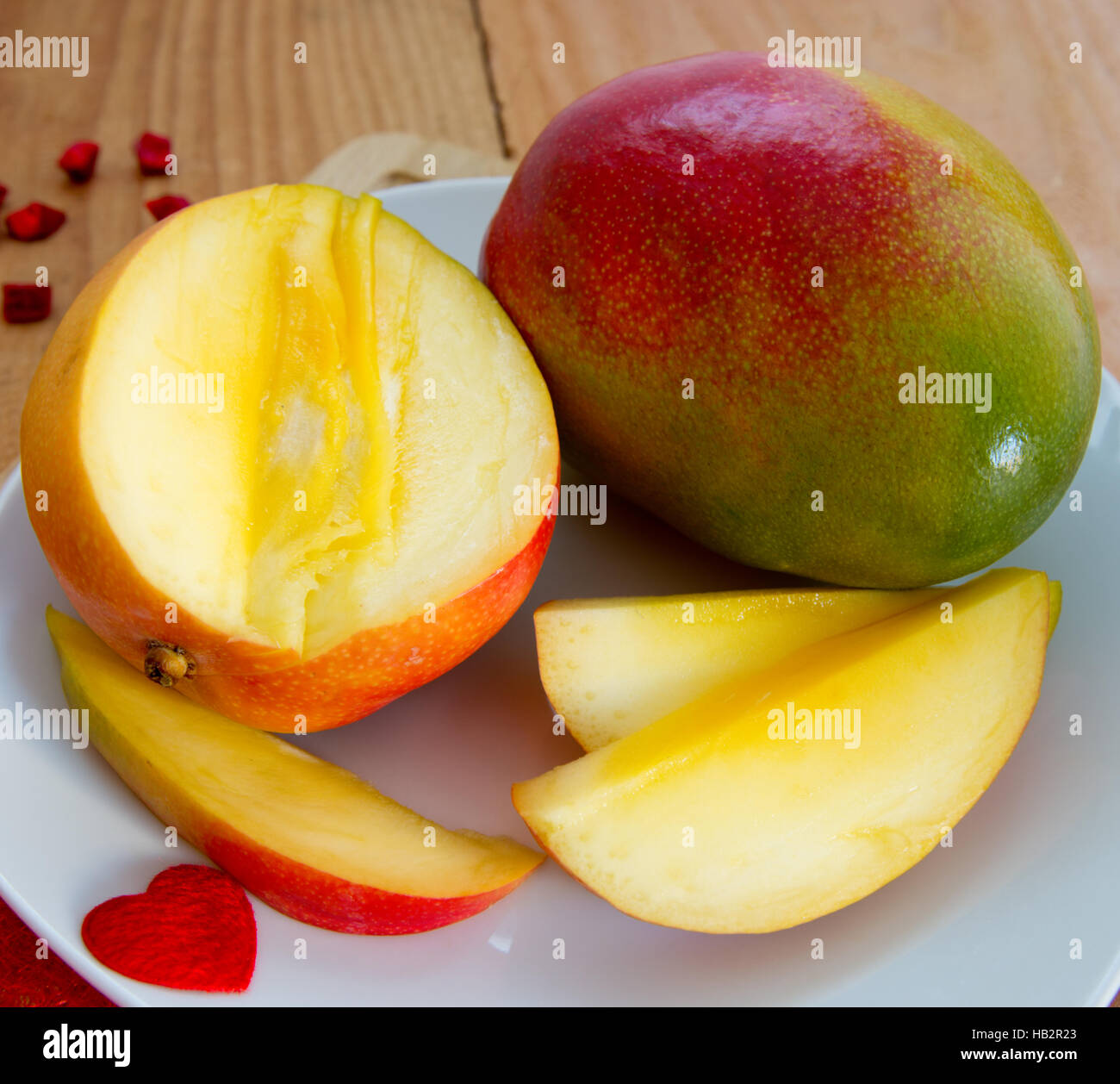 Mango fruit on wooden background Stock Photo - Alamy