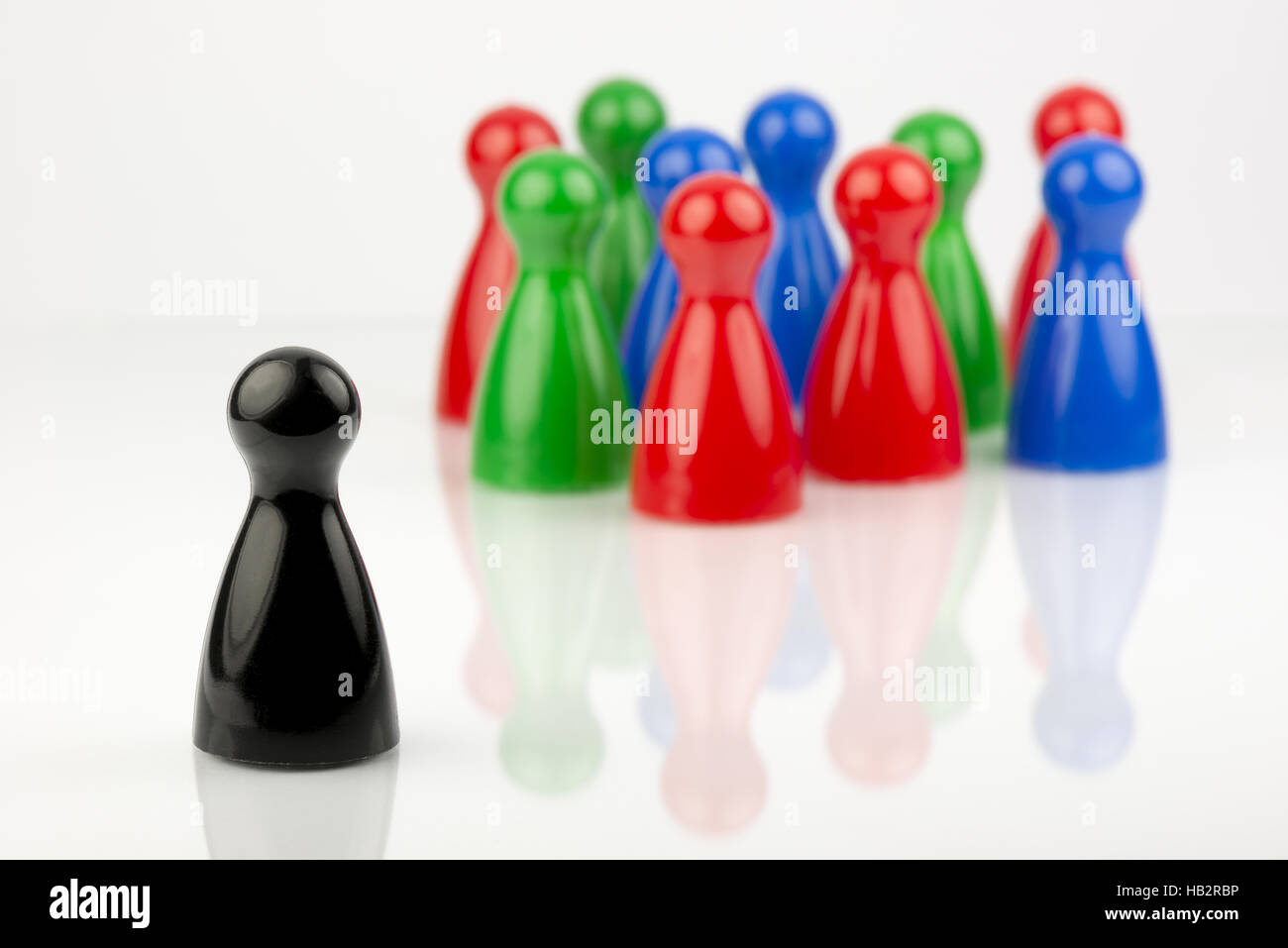 Conceptual game pawns Stock Photo - Alamy
