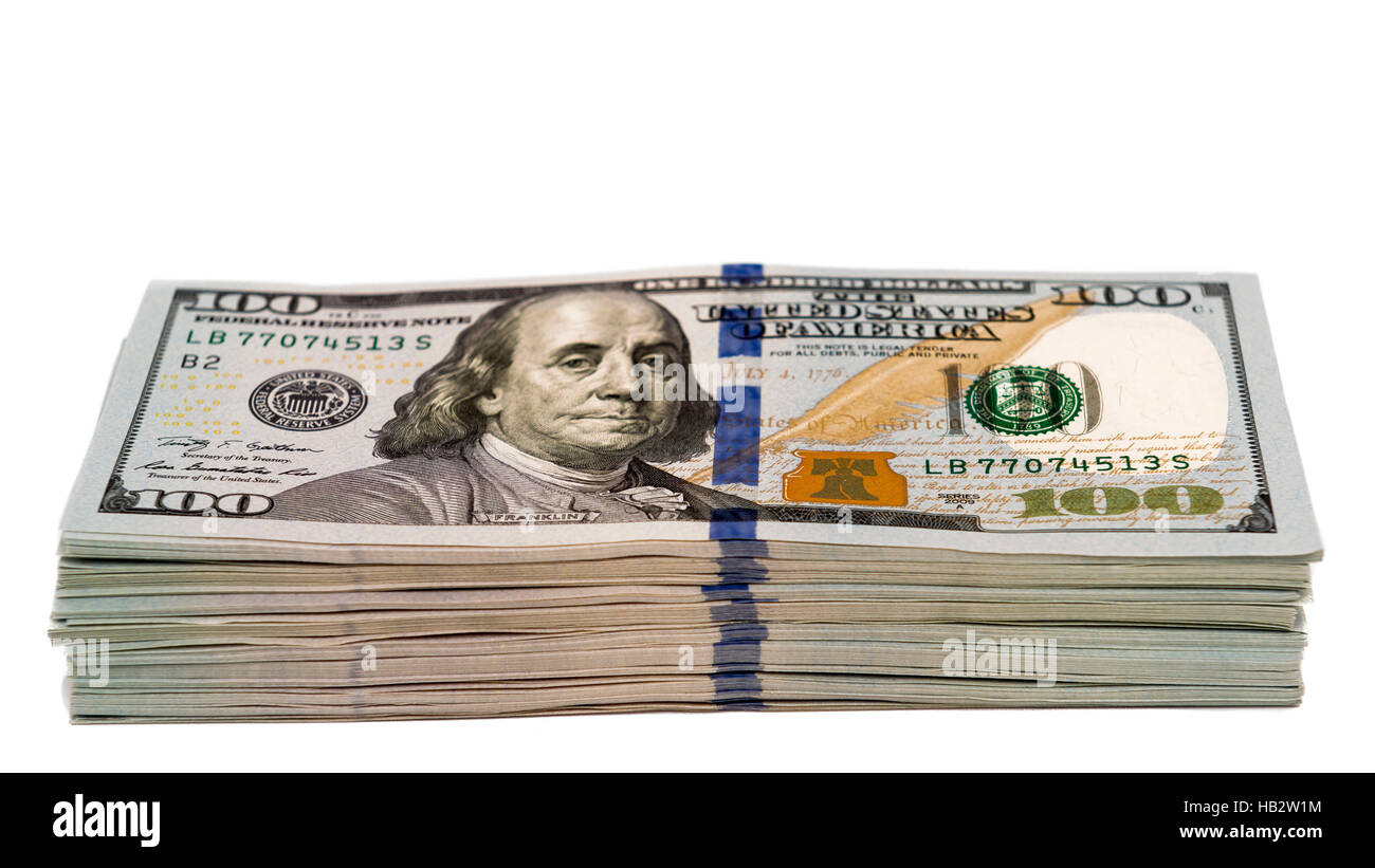 Stack of hundred dollar cash banknotes isolated with focus on the ...