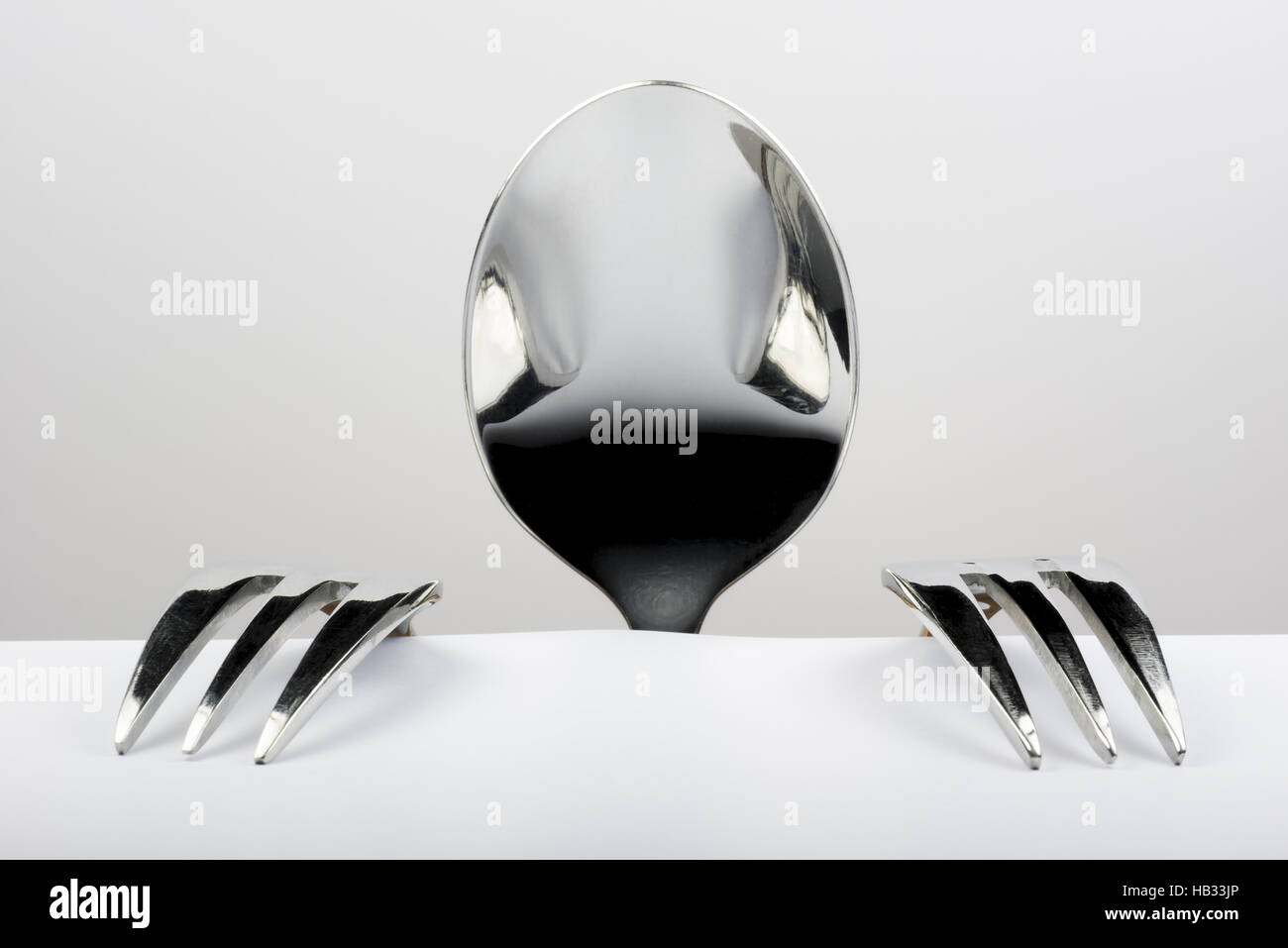 Figure of spoon and two forks Stock Photo - Alamy