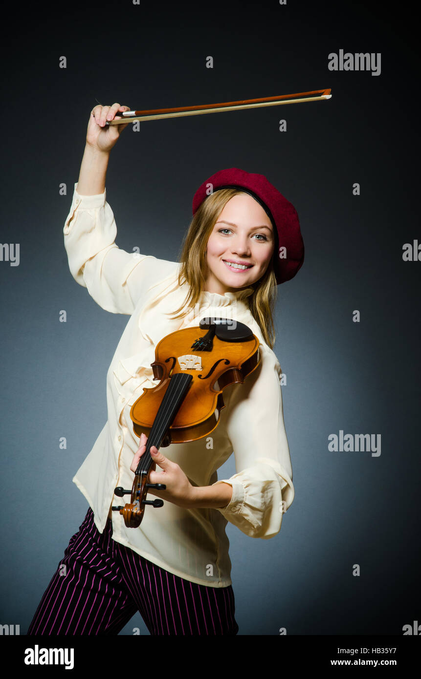 Woman violin player in musical concept Stock Photo - Alamy