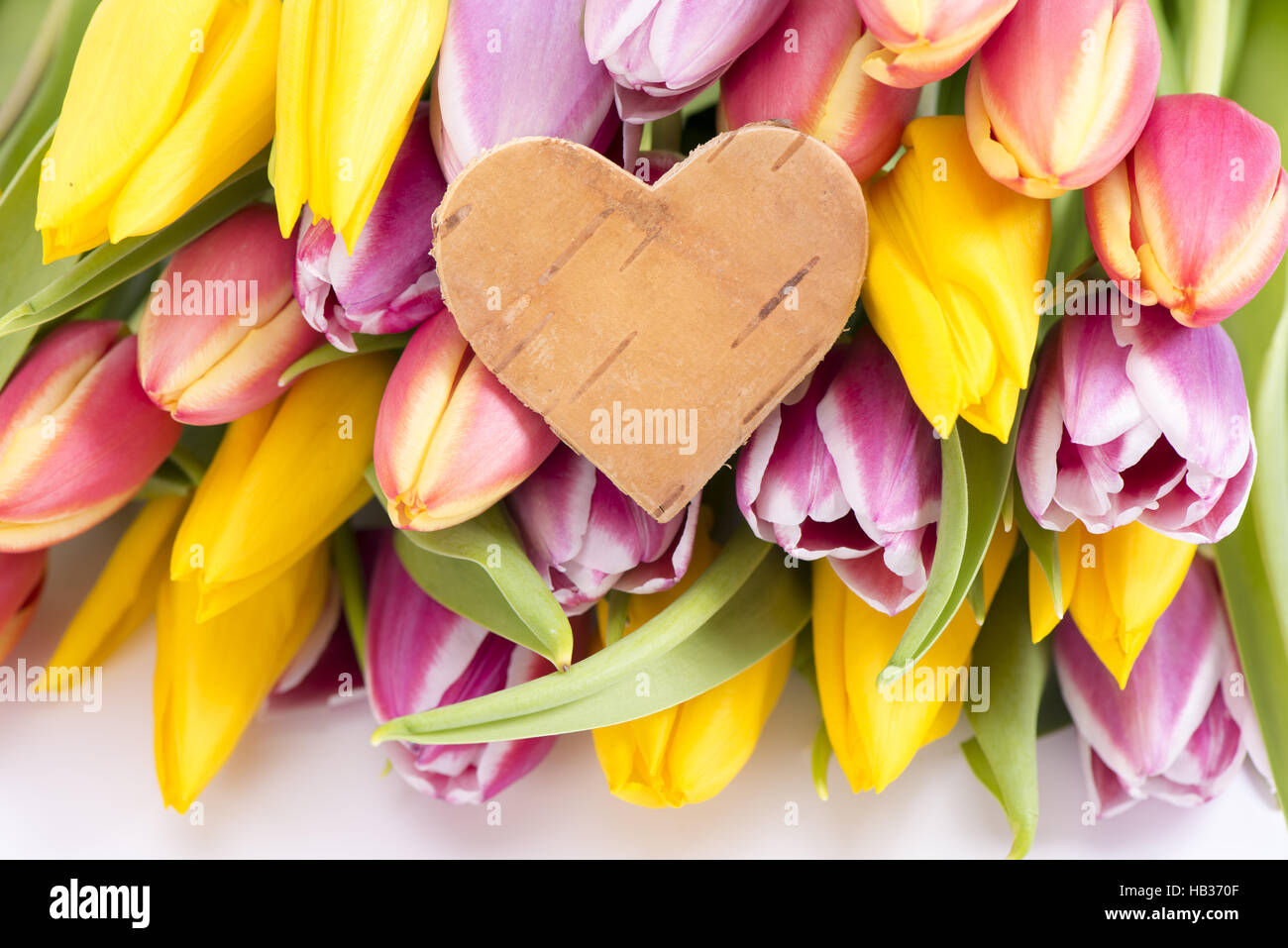 flowers wit heart as symbol for love Stock Photo - Alamy