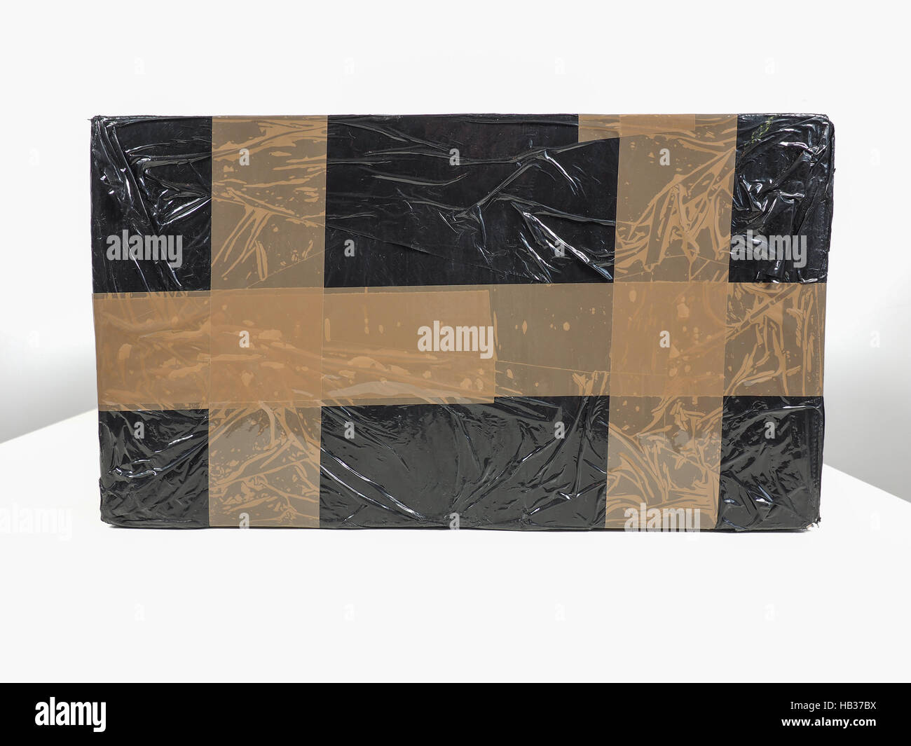 Black packet parcel Stock Photo - Alamy