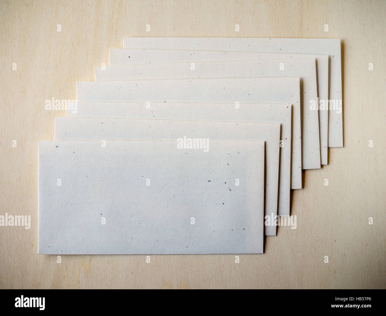 Letter envelope on wood table Stock Photo - Alamy