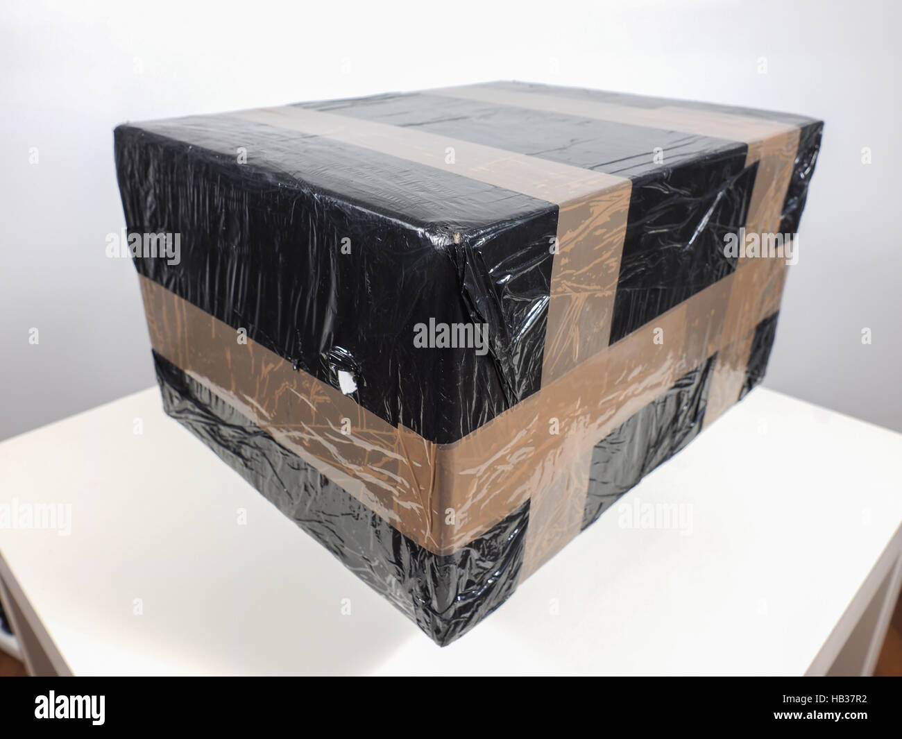 Black packet parcel Stock Photo - Alamy