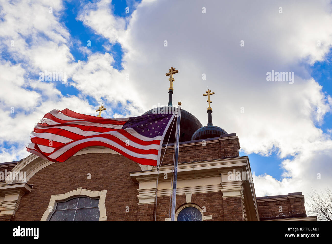 God Bless America American flag and old church steeple reflect ...