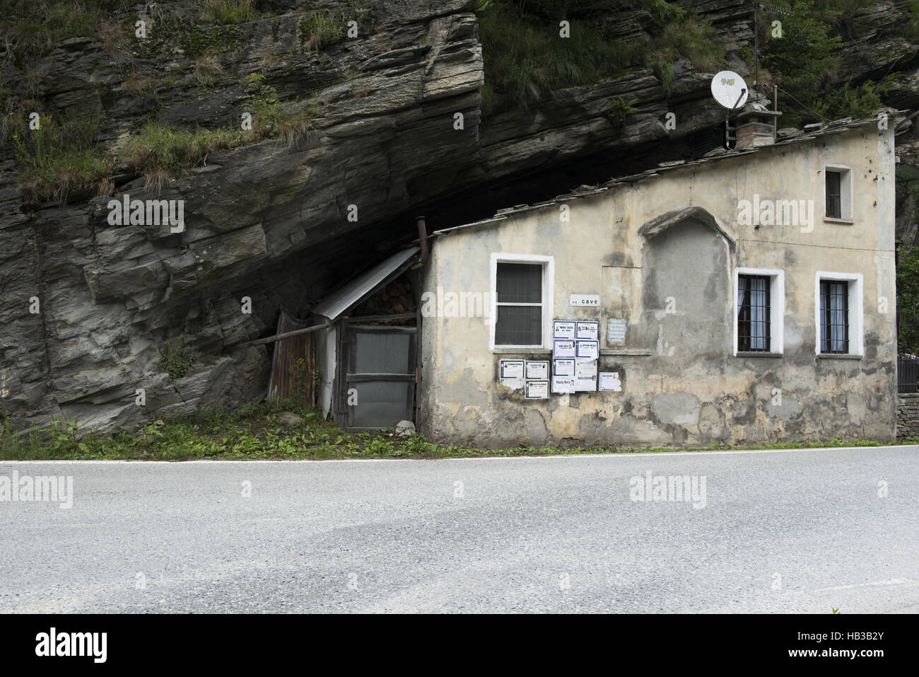 Old House under a Ledge Stock Photo - Alamy