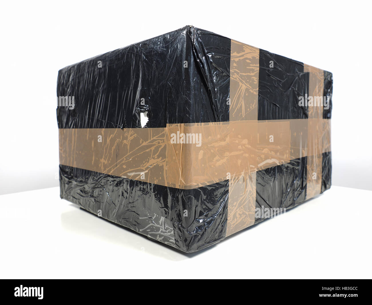 Black packet parcel Stock Photo - Alamy