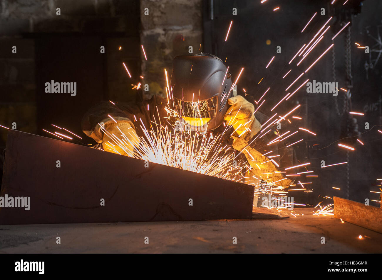 worker welding metal Stock Photo - Alamy