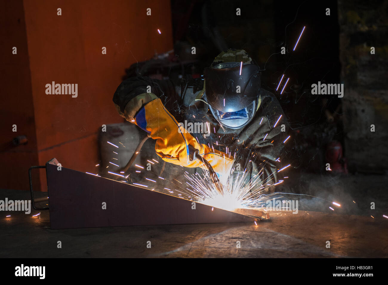 worker welding metal Stock Photo - Alamy