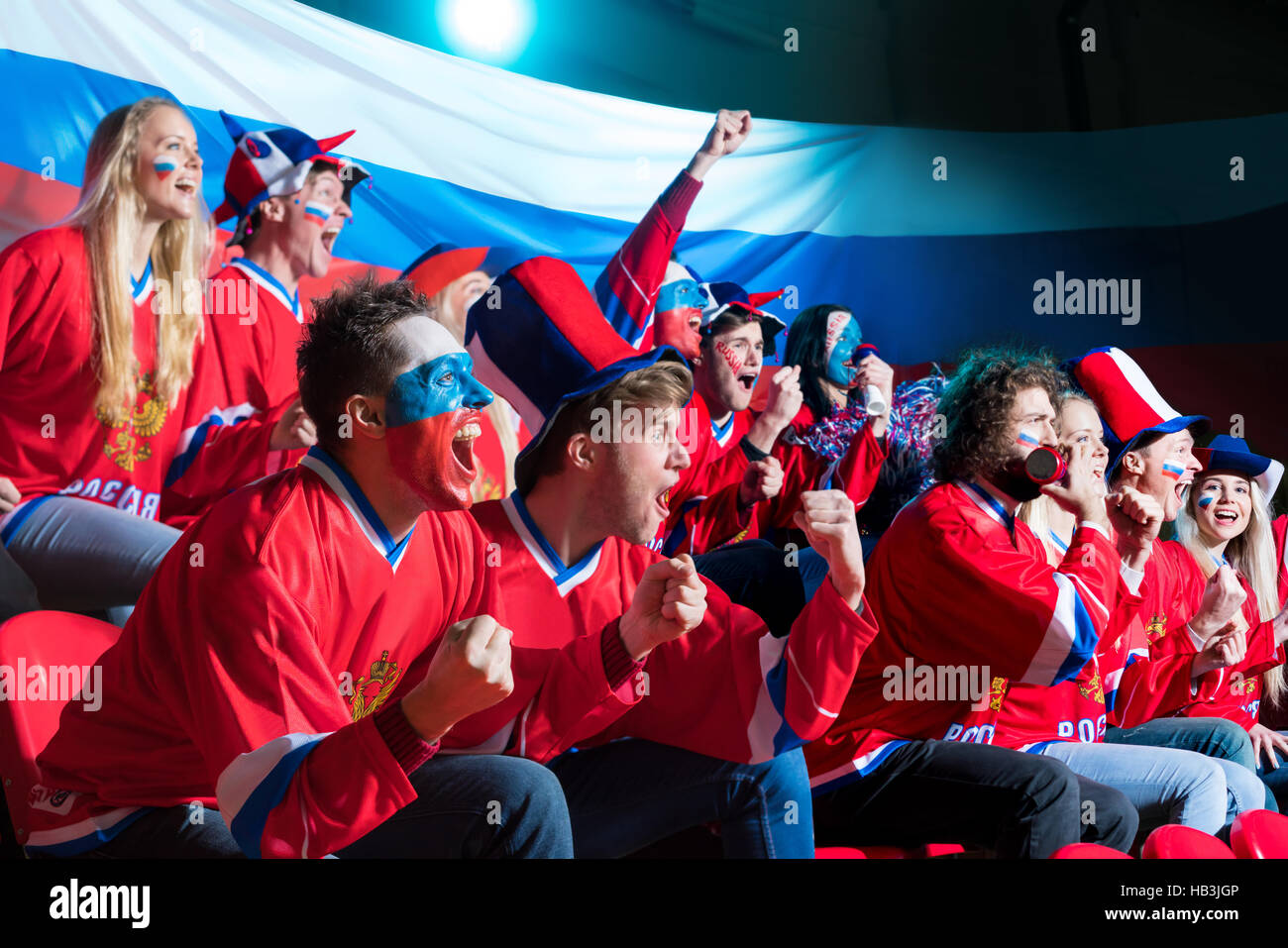 Fans in stadium Stock Photo - Alamy