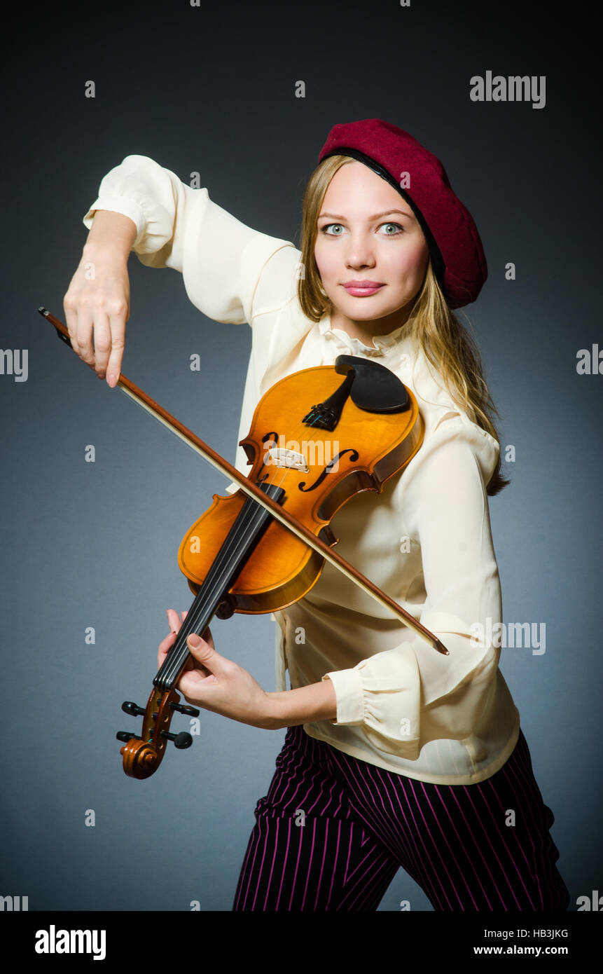 Woman violin player in musical concept Stock Photo - Alamy
