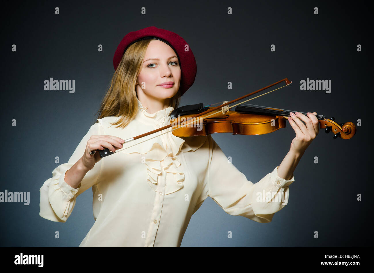 Woman violin player in musical concept Stock Photo - Alamy