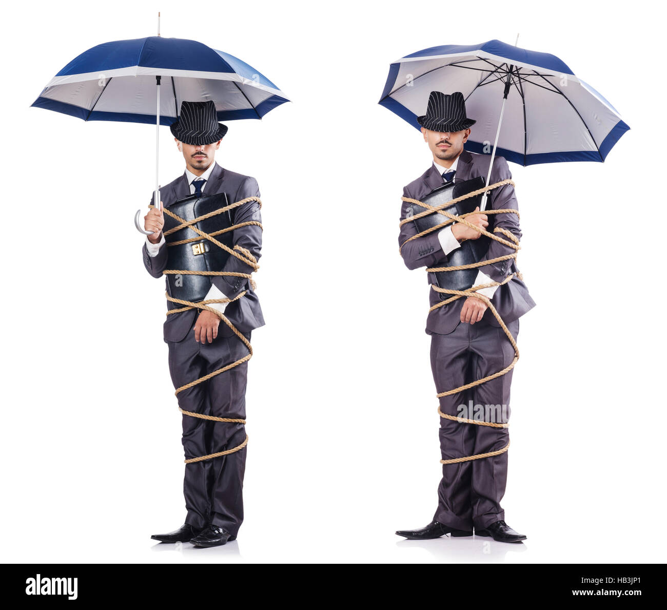 Businessman tied up with rope Stock Photo - Alamy