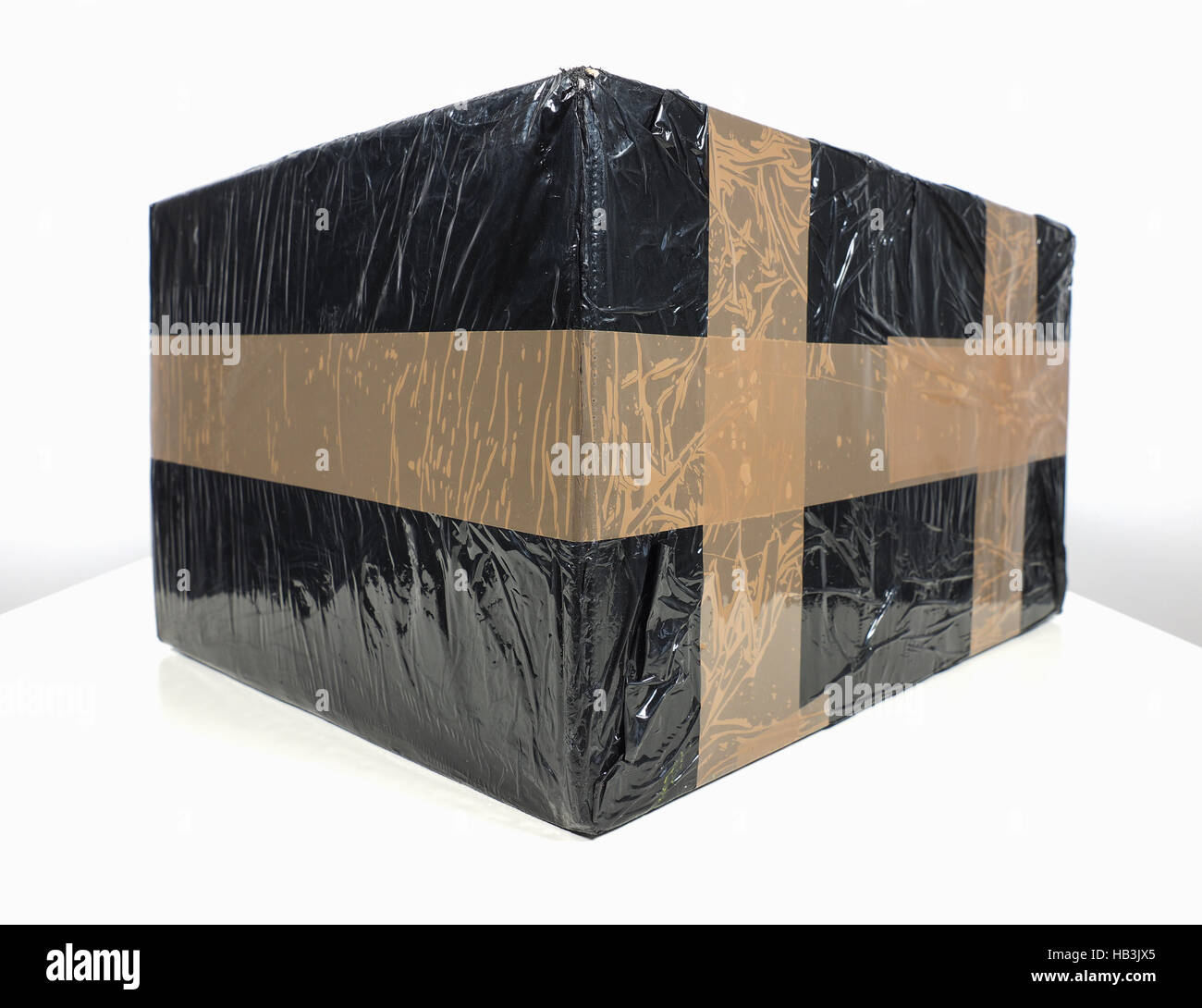 Black packet parcel Stock Photo - Alamy