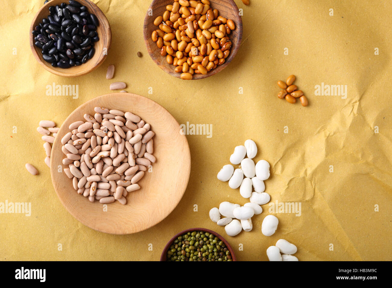 Assortment of beans on paper, food top view Stock Photo - Alamy