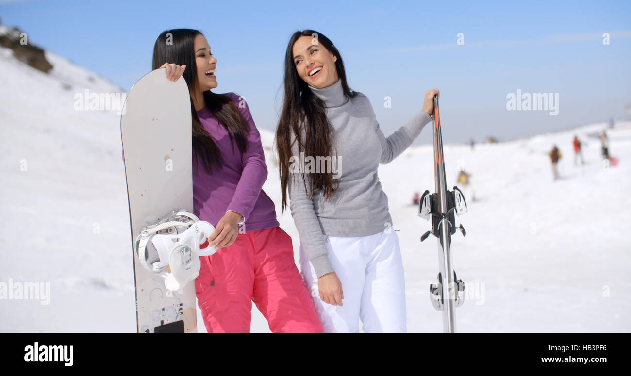 Two attractive female friends at a ski resort Stock Photo - Alamy