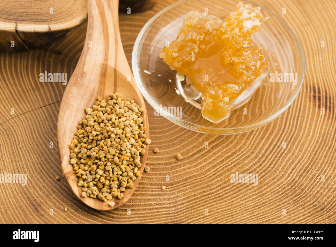 Fresh bee pollen in the spoon with honeycomb Stock Photo - Alamy