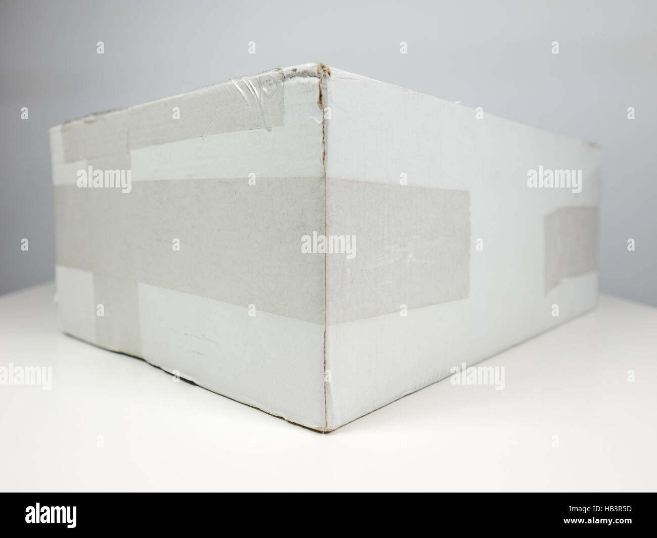 White packet parcel Stock Photo - Alamy