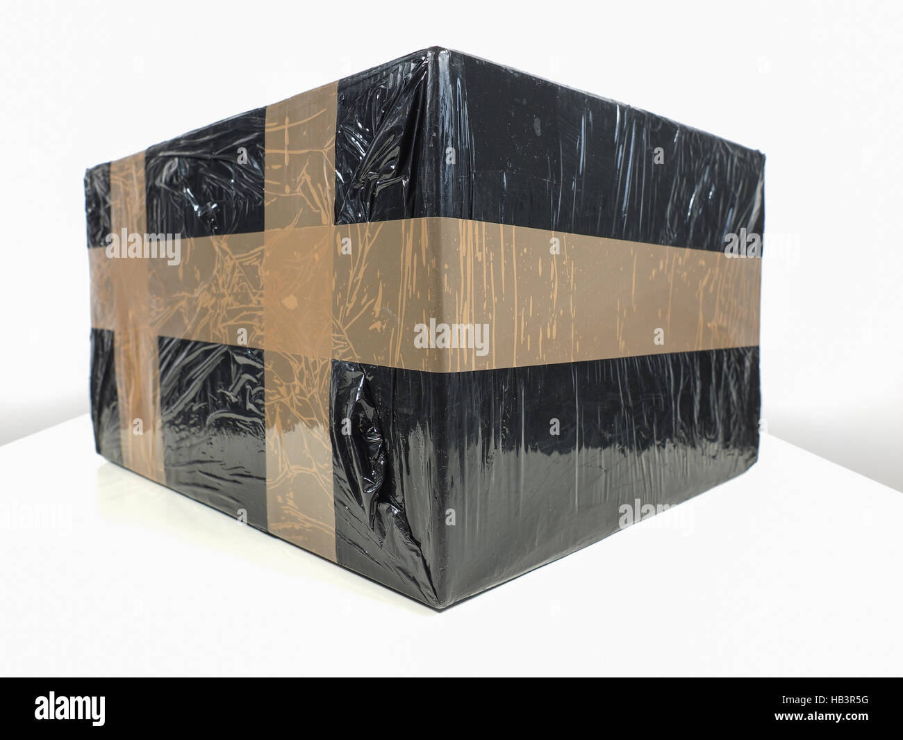 Black packet parcel Stock Photo - Alamy