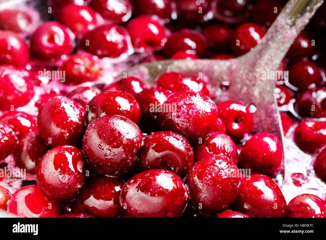 Red cherries in sugar syrup Stock Photo - Alamy
