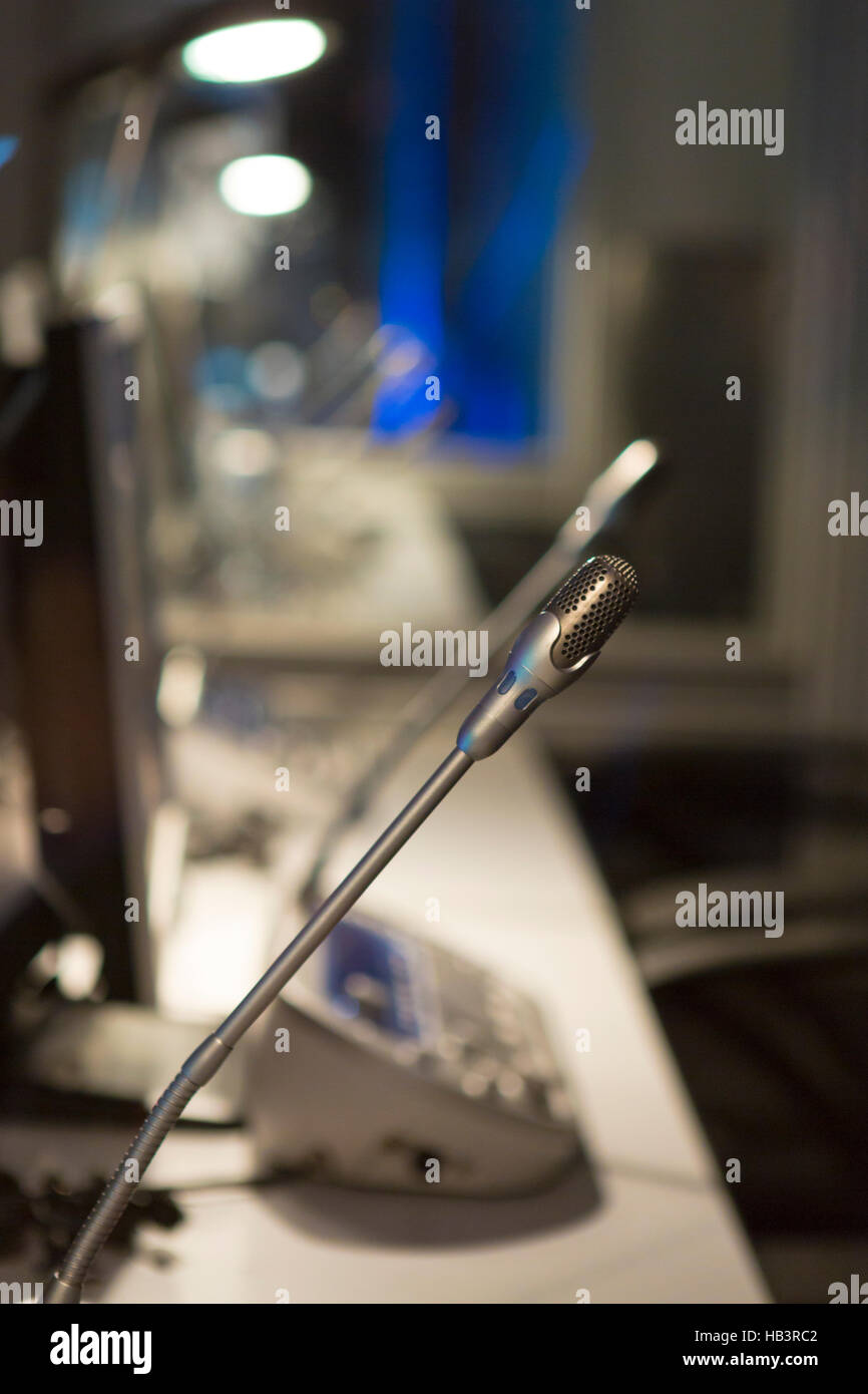 Inside interpreter booth with close up on microphone Stock Photo - Alamy