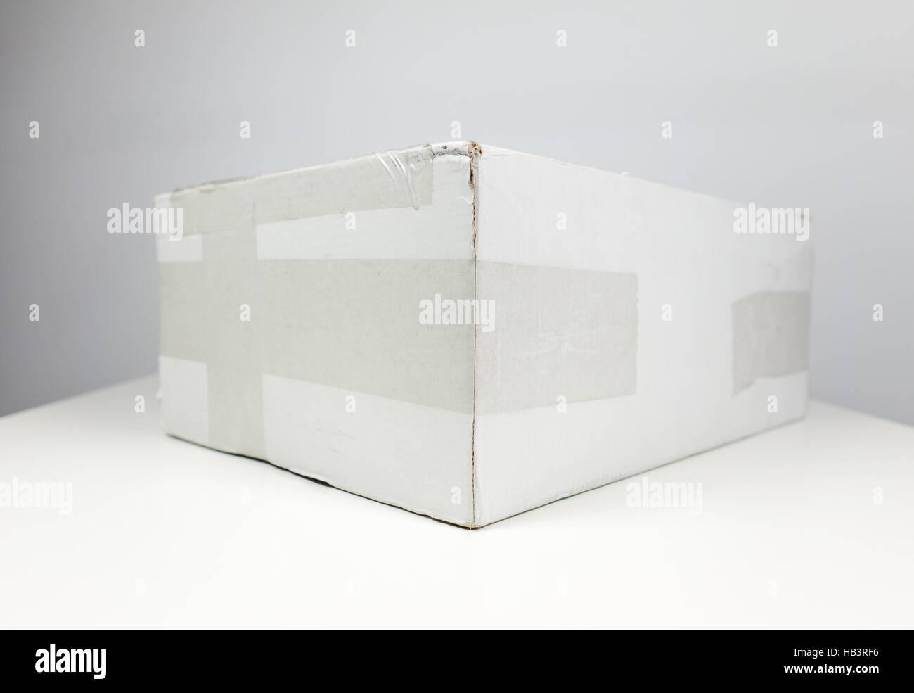 White packet parcel Stock Photo - Alamy