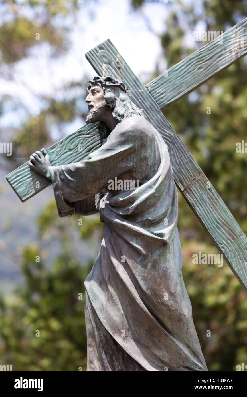 Christ antique statue carrying the Christian cross in Bogota Stock ...