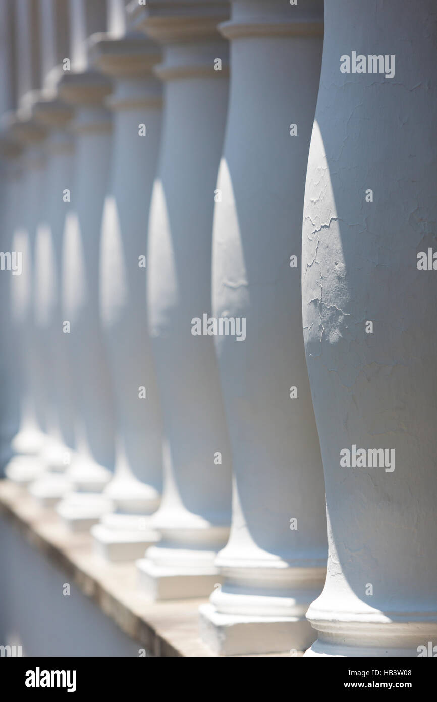 Colonial architectural details in Quito, white columns aligned in a row ...