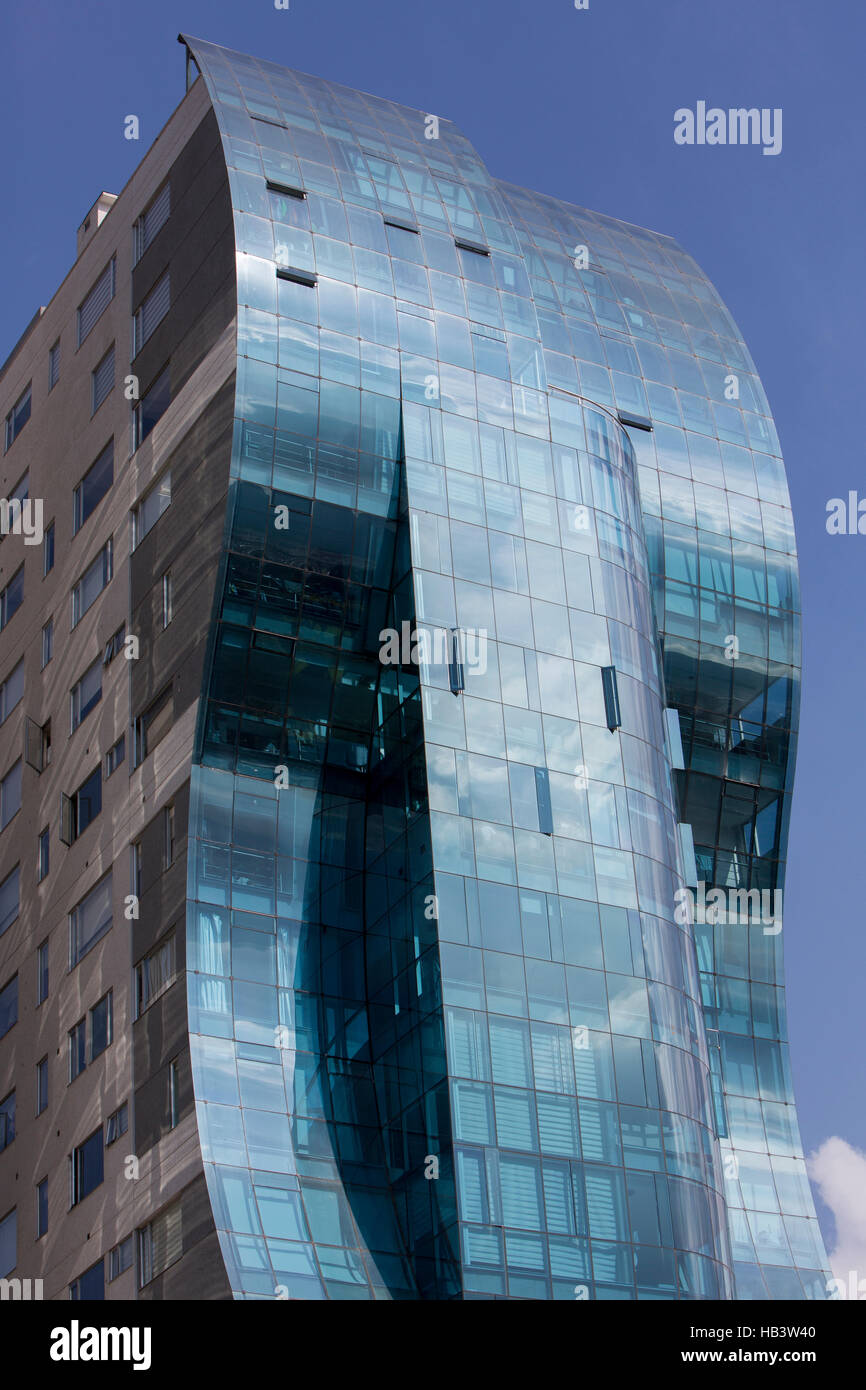 Blue modern buildings reflecting the blue cloudy sky in Quito Stock ...