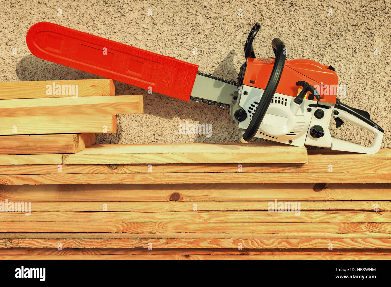 Chainsaw and lumber Stock Photo - Alamy