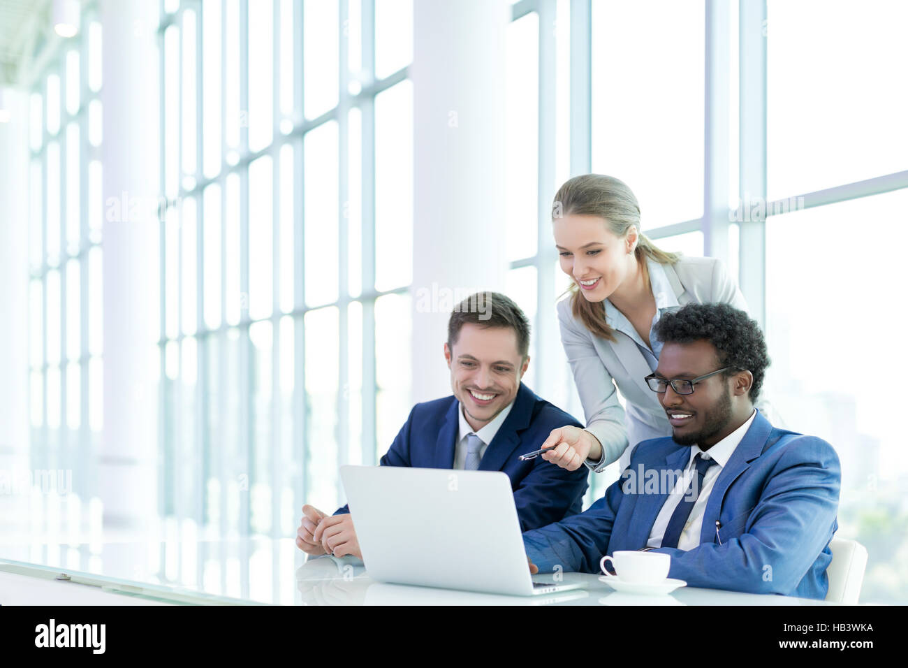 Business people with laptop Stock Photo - Alamy