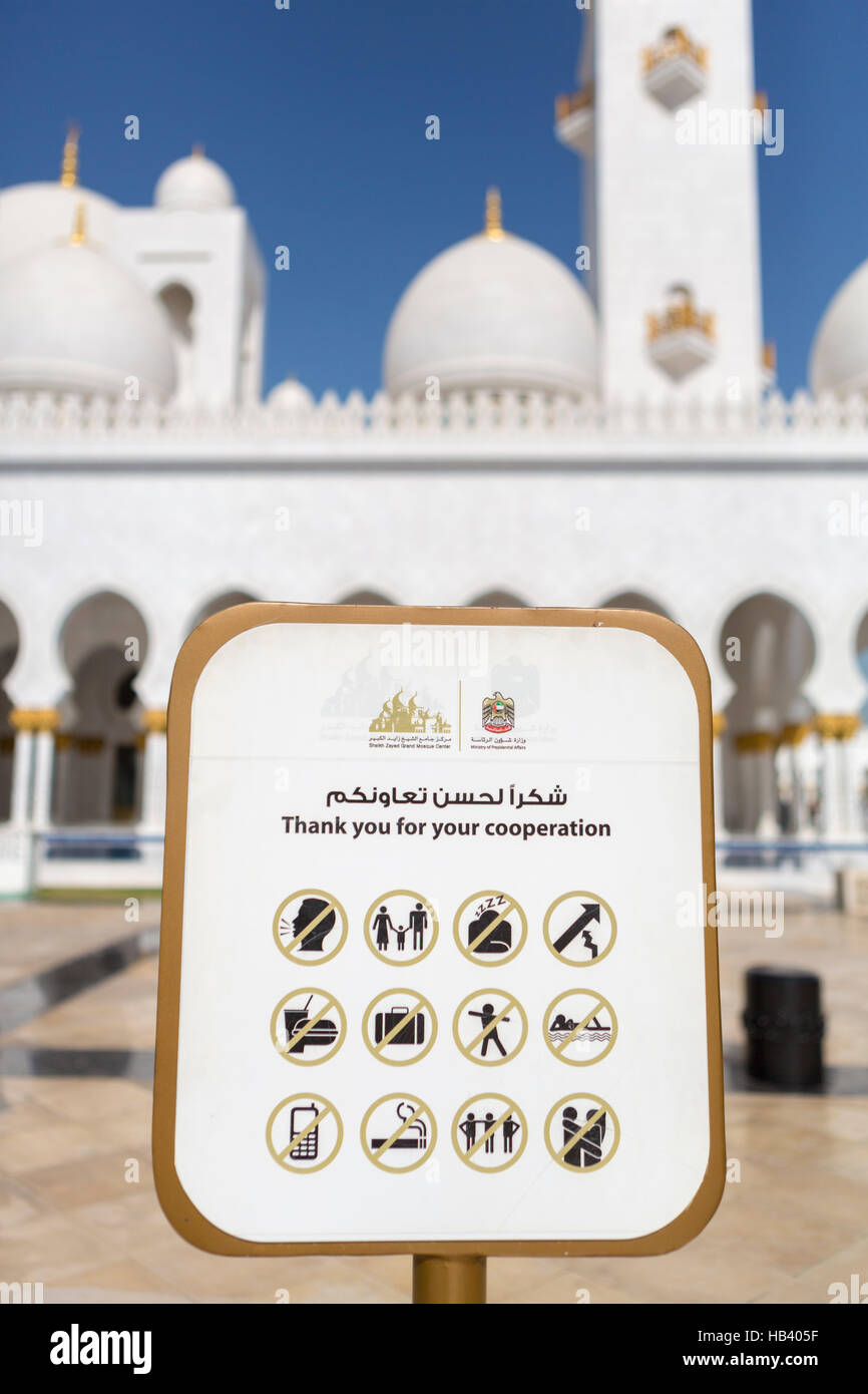 Signboard with the rules to follow at the Abu Dhabi Mosque Stock Photo ...